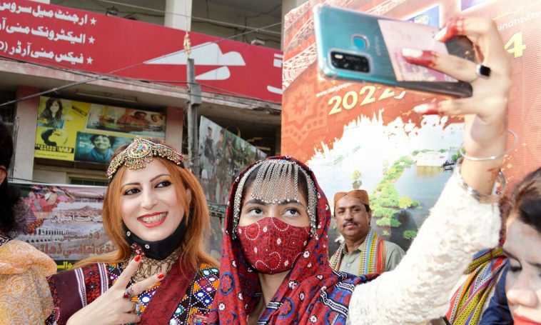 Men and Women Celebrate Sindhi Culture Day with Singing and Dancing ...